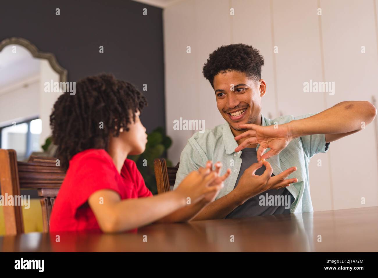 Teaching sign language hi-res stock photography and images - Alamy