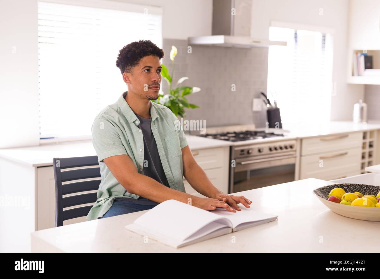 Happy blind man reading braille hi-res stock photography and images - Alamy