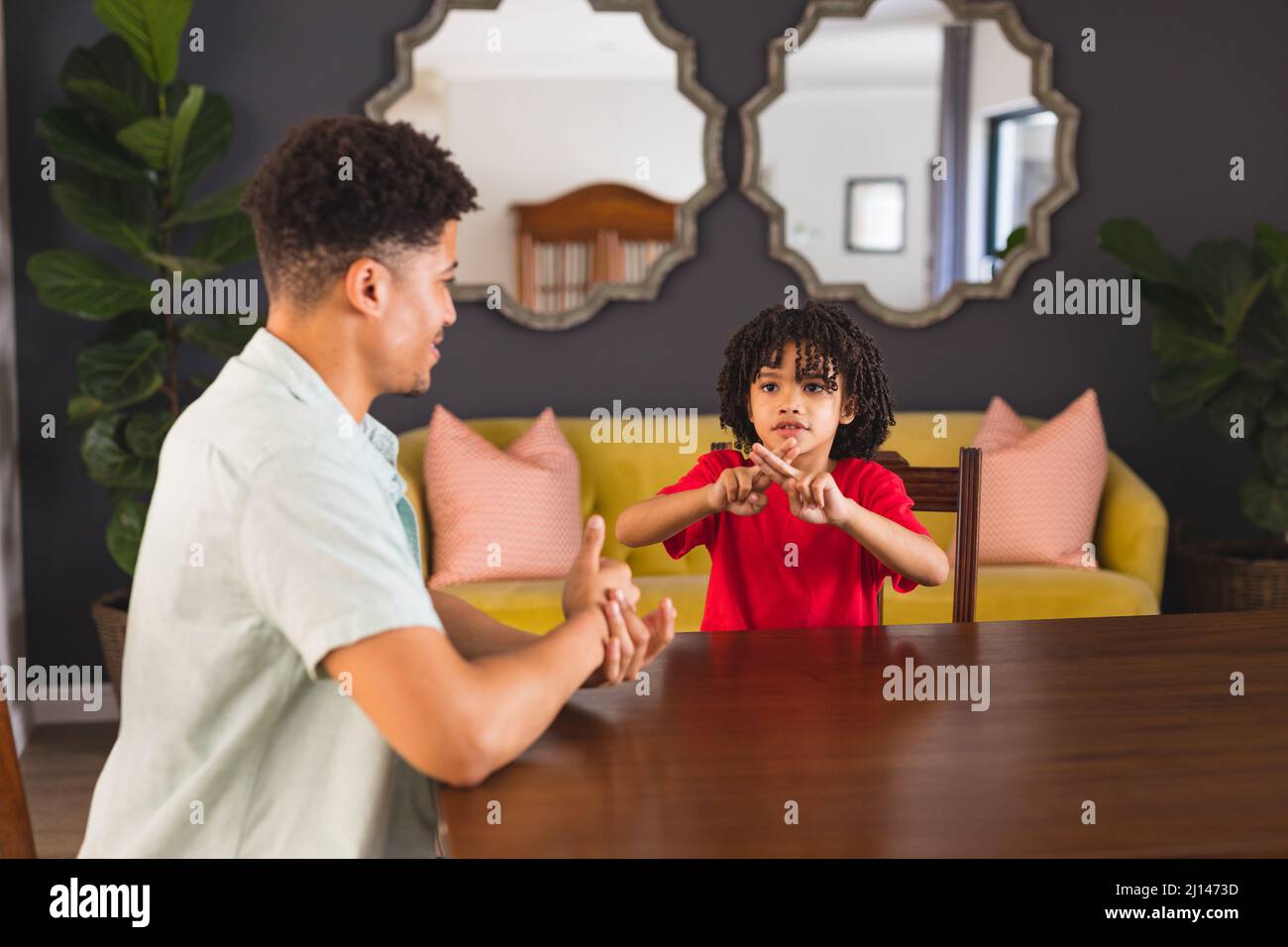Hispanic family sign language hi-res stock photography and images - Alamy