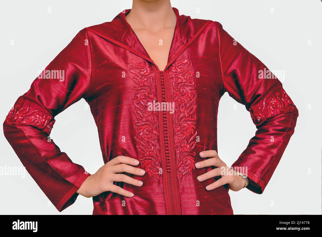 Details of a red Moroccan caftan for women, with her embroidery and ...