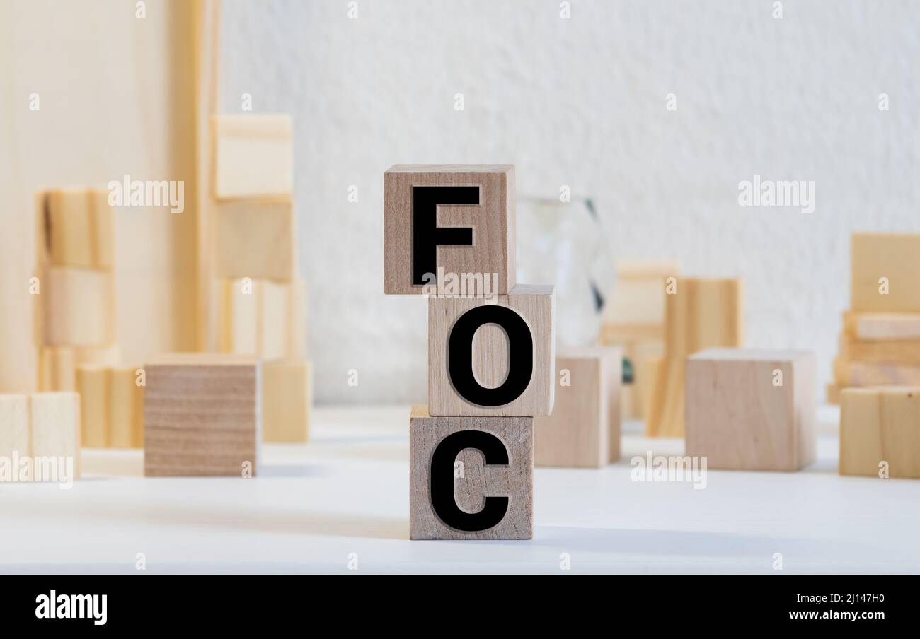 Alphabet letter in word FOC Abbreviation of Free of charge on wood ...