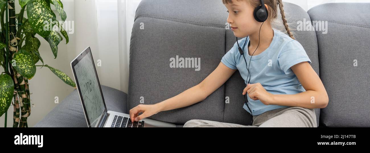 Homeschool little young girl student learning virtual internet online ...