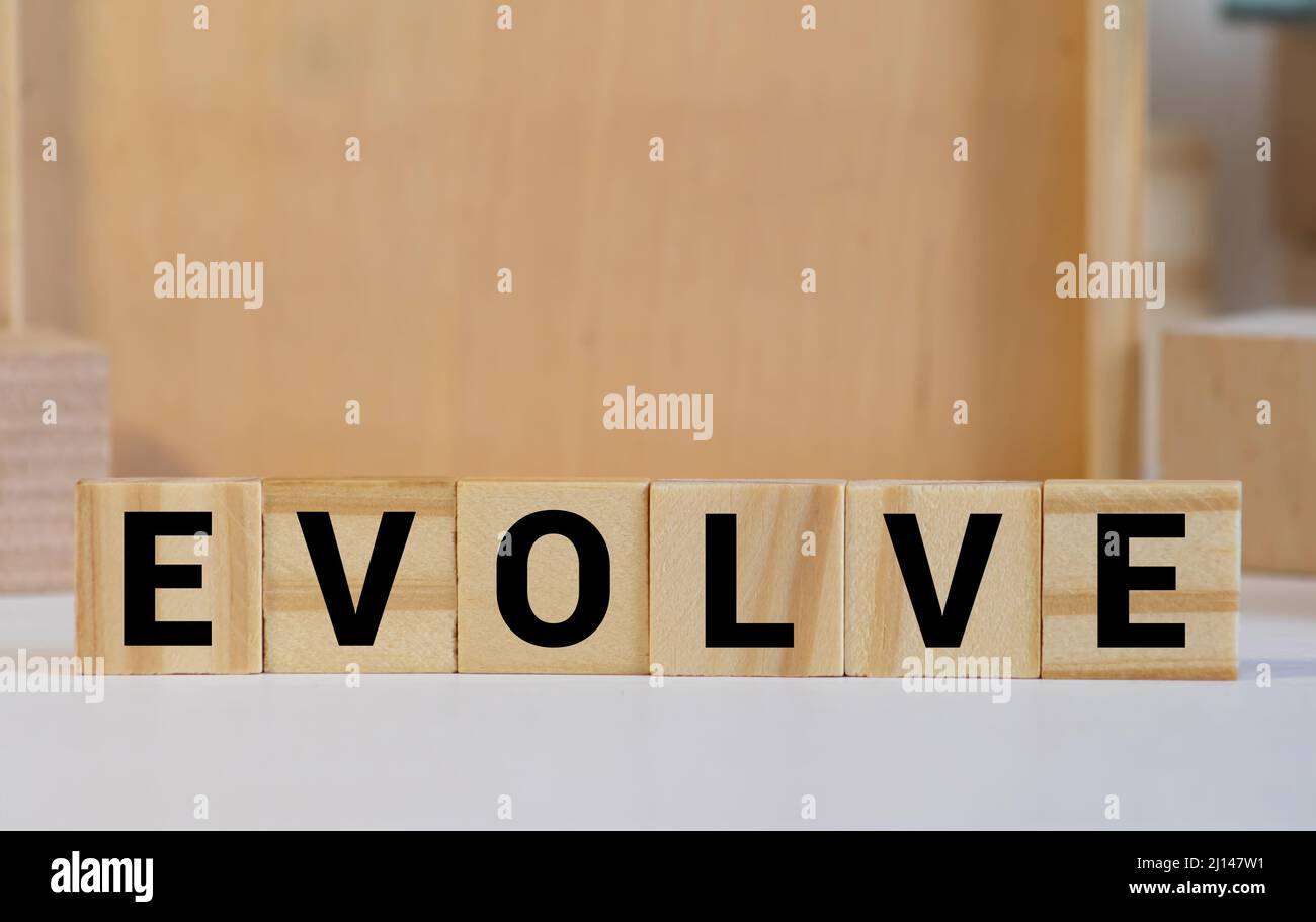 EVOLVE word made with building blocks isolated on white Stock Photo - Alamy