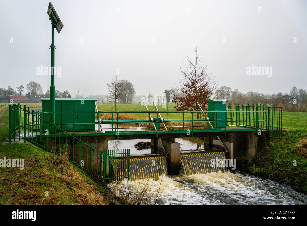 Rural landscape with a weir Stock Photo - Alamy