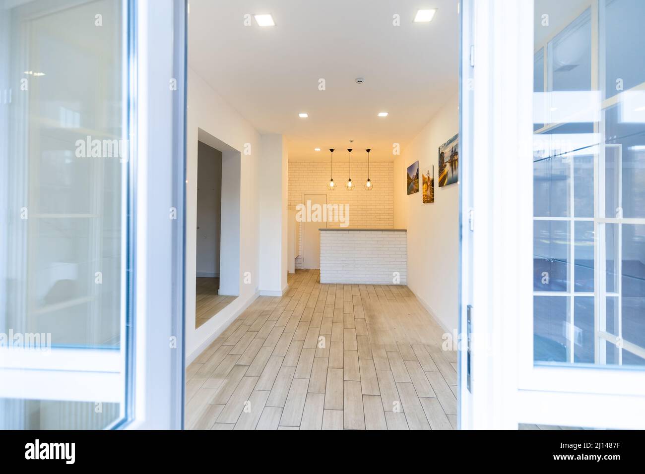 Reception desk in a corridor in a small office Stock Photo - Alamy