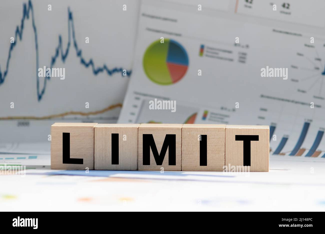 Letter block in word limited on wood background Stock Photo - Alamy