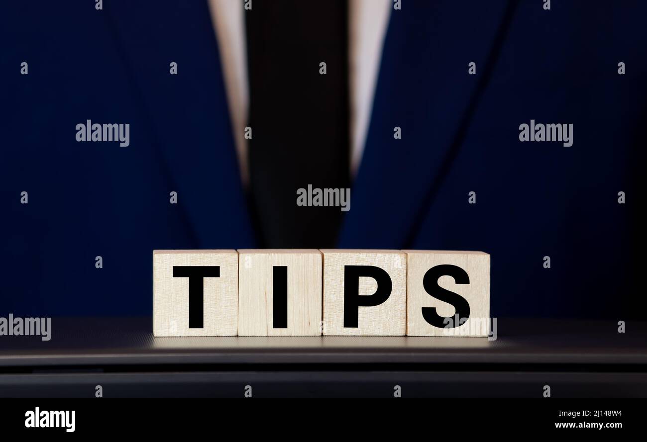 Tips word collected of wooden elements with the letters Stock Photo - Alamy