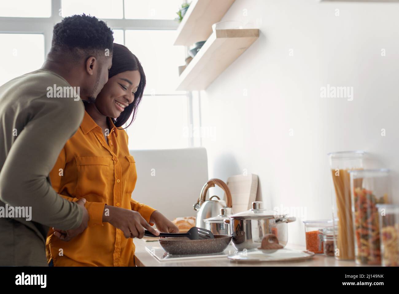 Portrait Of Romantic Young African American Couple Cooking Together In ...
