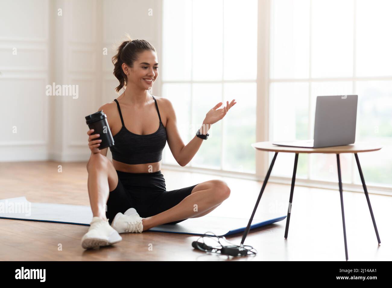 Young woman streaming video using hi-res stock photography and images ...
