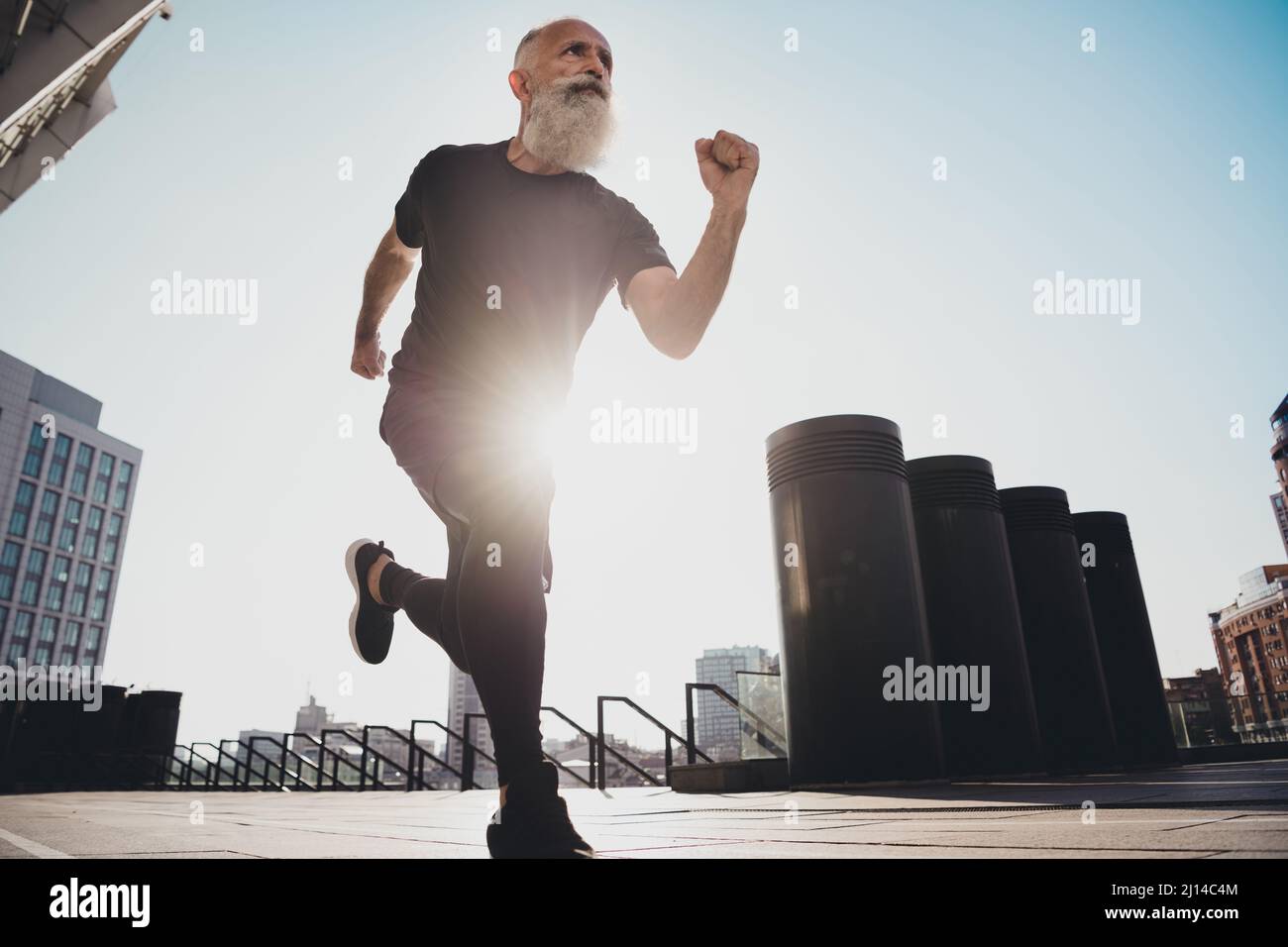 Full length body size view of attractive elderly retired sportive grey ...