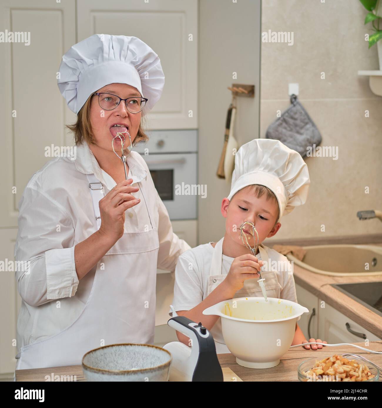 Teen boy and mom in kitchen hi-res stock photography and images - Alamy