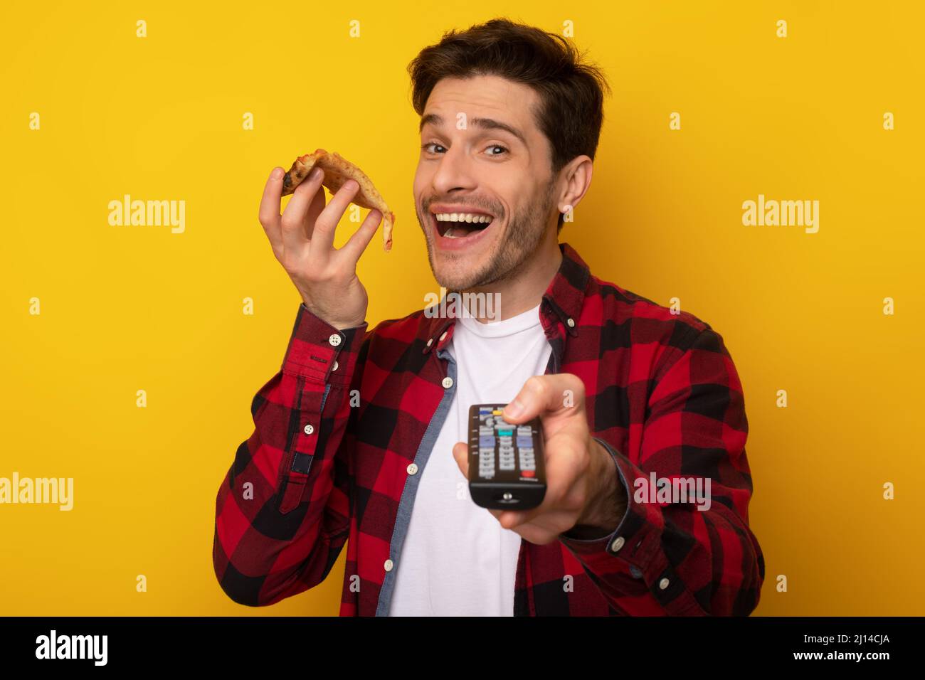 Funny Guy Eating Pizza Holding Remote Control Watching Tv Stock Photo ...