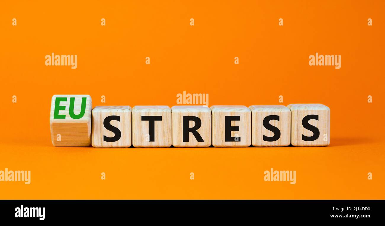 Eustress or stress symbol. Turned the wooden cube and changed the ...