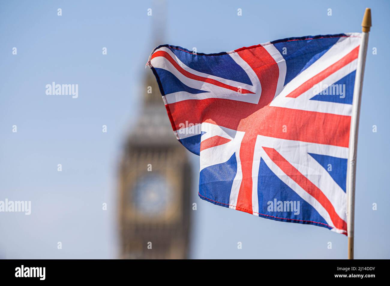 22 March 2022. Union Jack fluttering in front of Big Ben clock tower ...