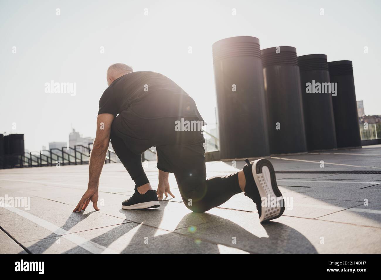 Rear back view photo of ready position retired old man stand fingers ...