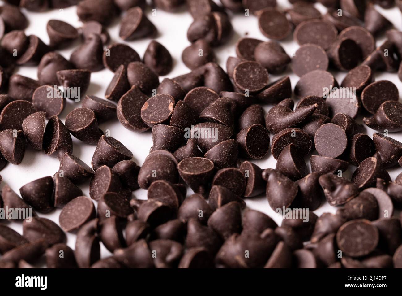 Close-up full frame shot of fresh chocolate chips on white background ...