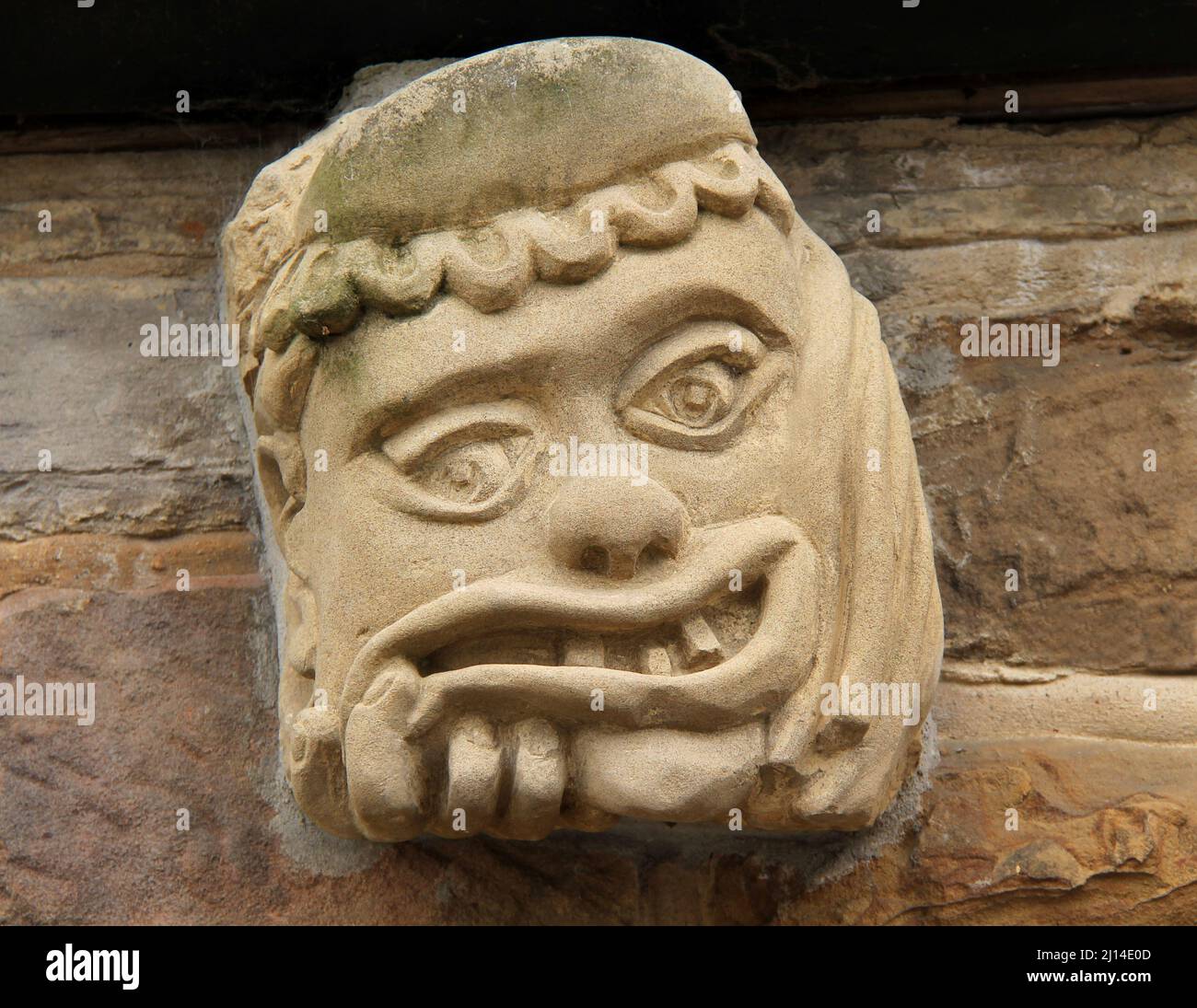 An Ancient Stone Face Gargoyle Mounted on a Wall Stock Photo - Alamy