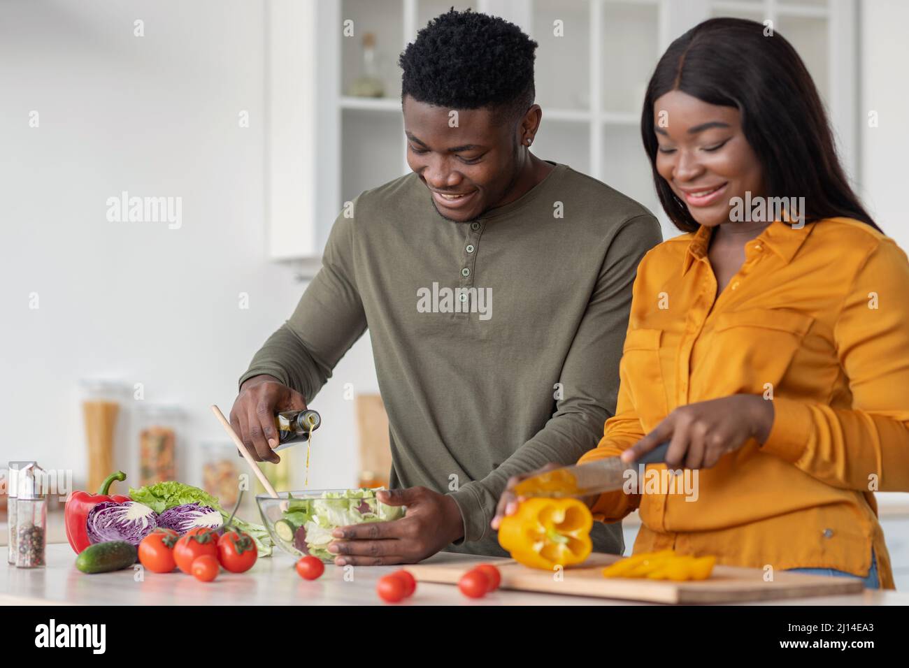 Lovers cooking together in kitchen hi-res stock photography and images ...