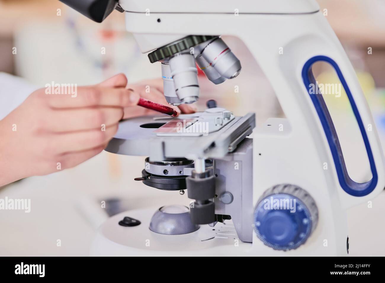 Studying samples under the mircroscope. Closeup shot of a scientist ...