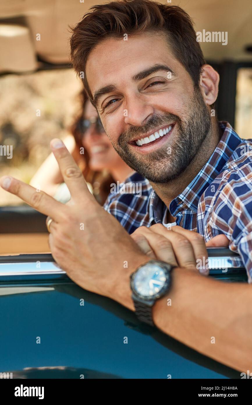 Peace. Cropped portrait of a handsome man giving you a peace sign while ...