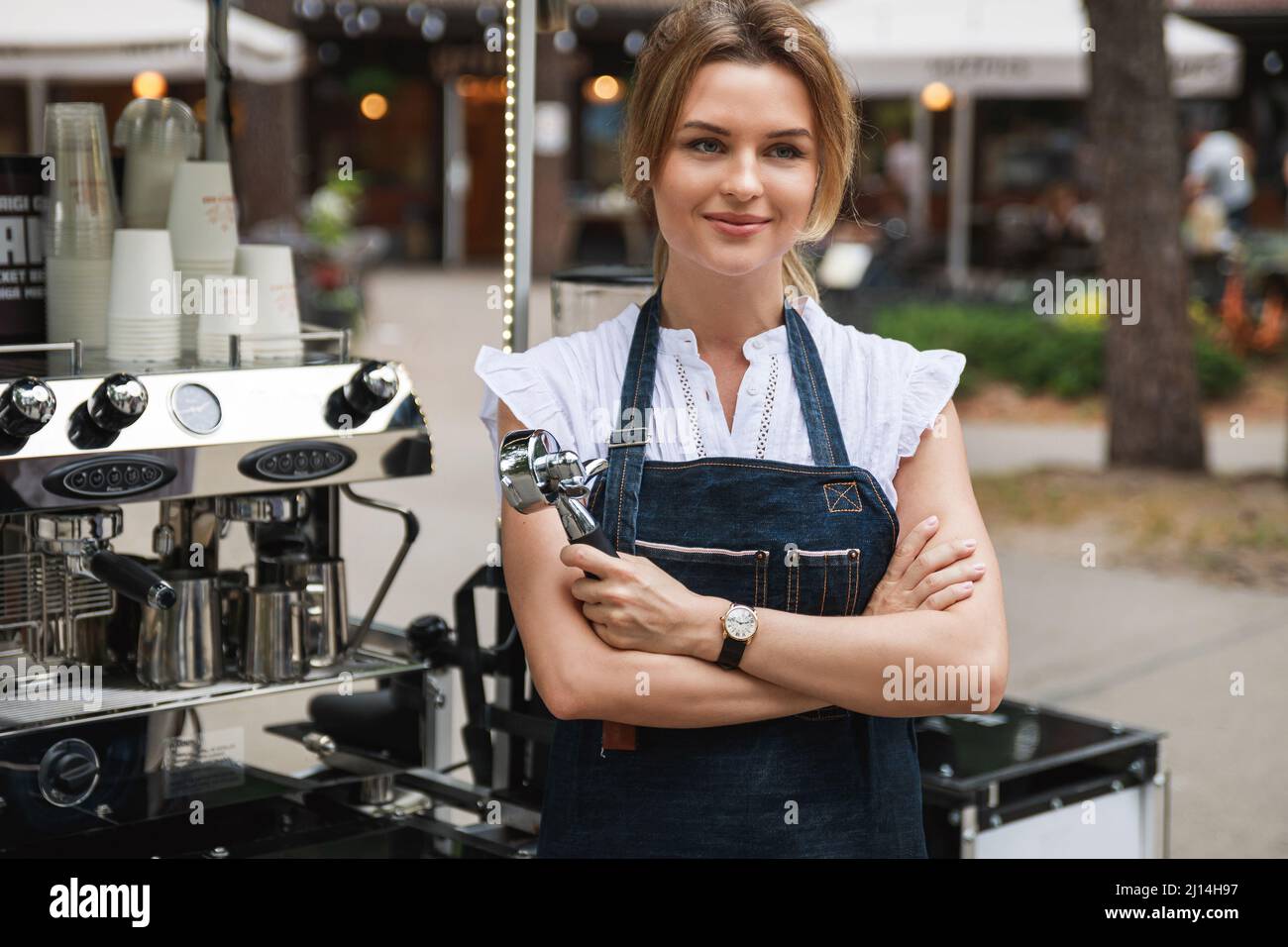 Beautiful barista woman during work in her street coffee shop Stock ...
