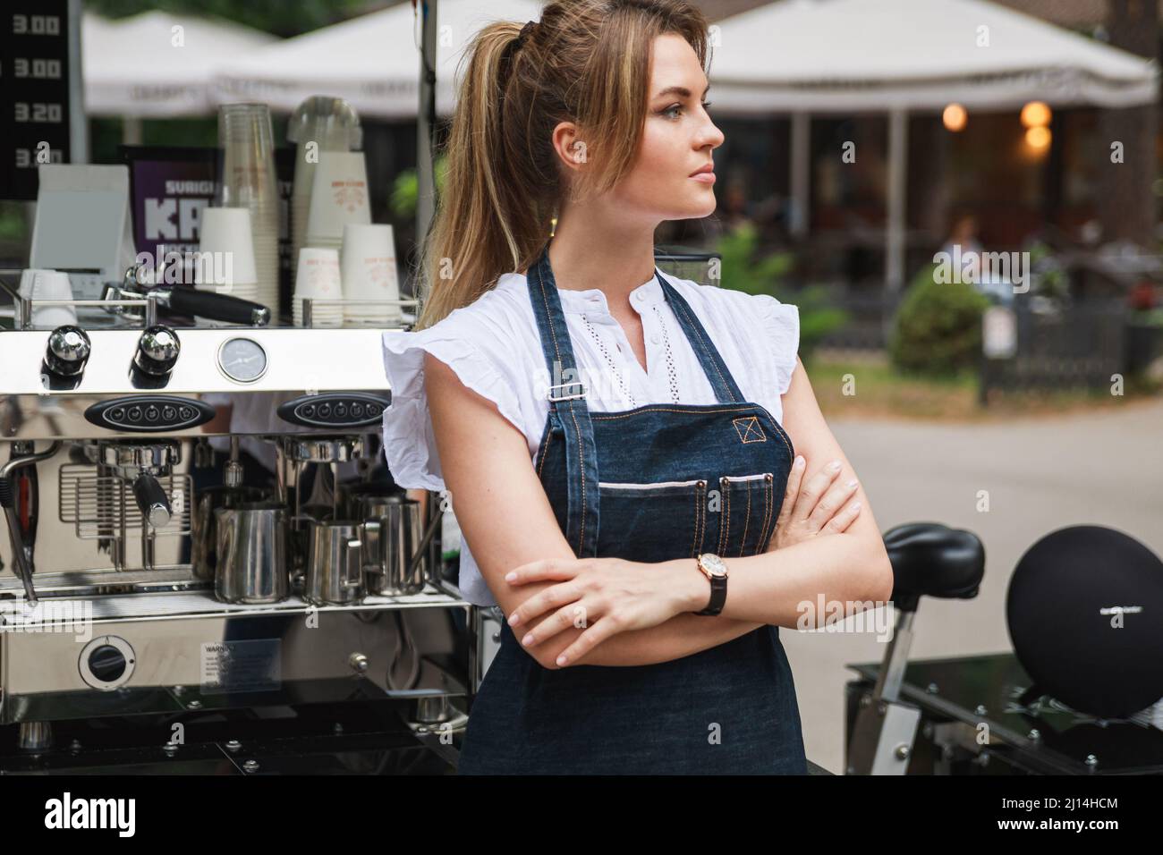 Beautiful barista woman during work in her street coffee shop Stock ...