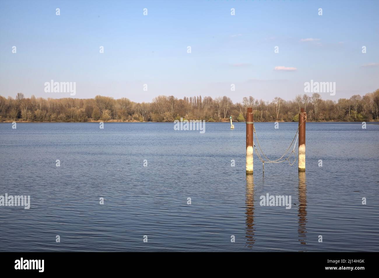 Mooring on a lake with reflection casted in the water on a sunny day ...