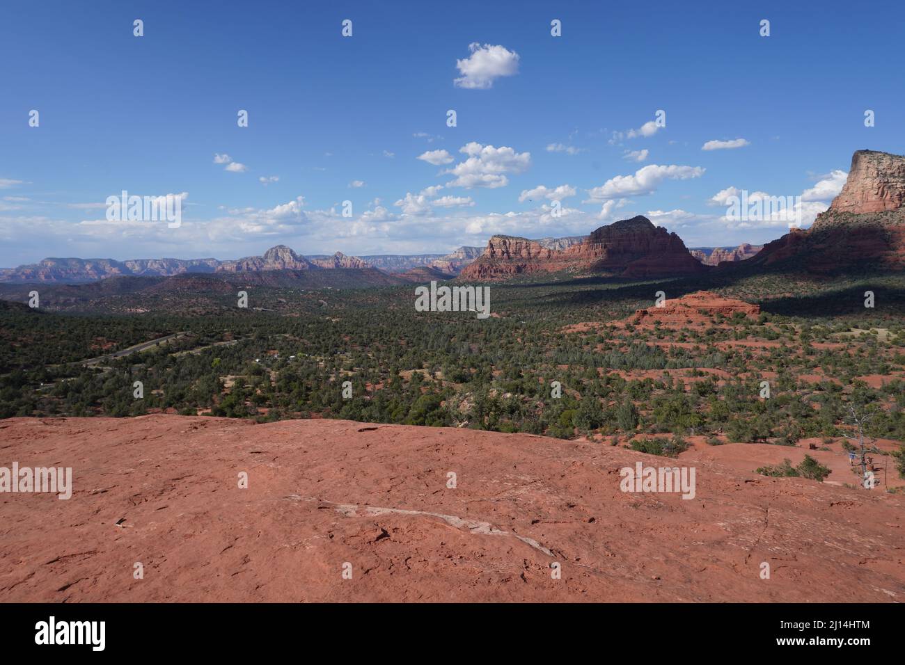 Scenic view of deserted red rocks covered with green shrubs in Sedona ...