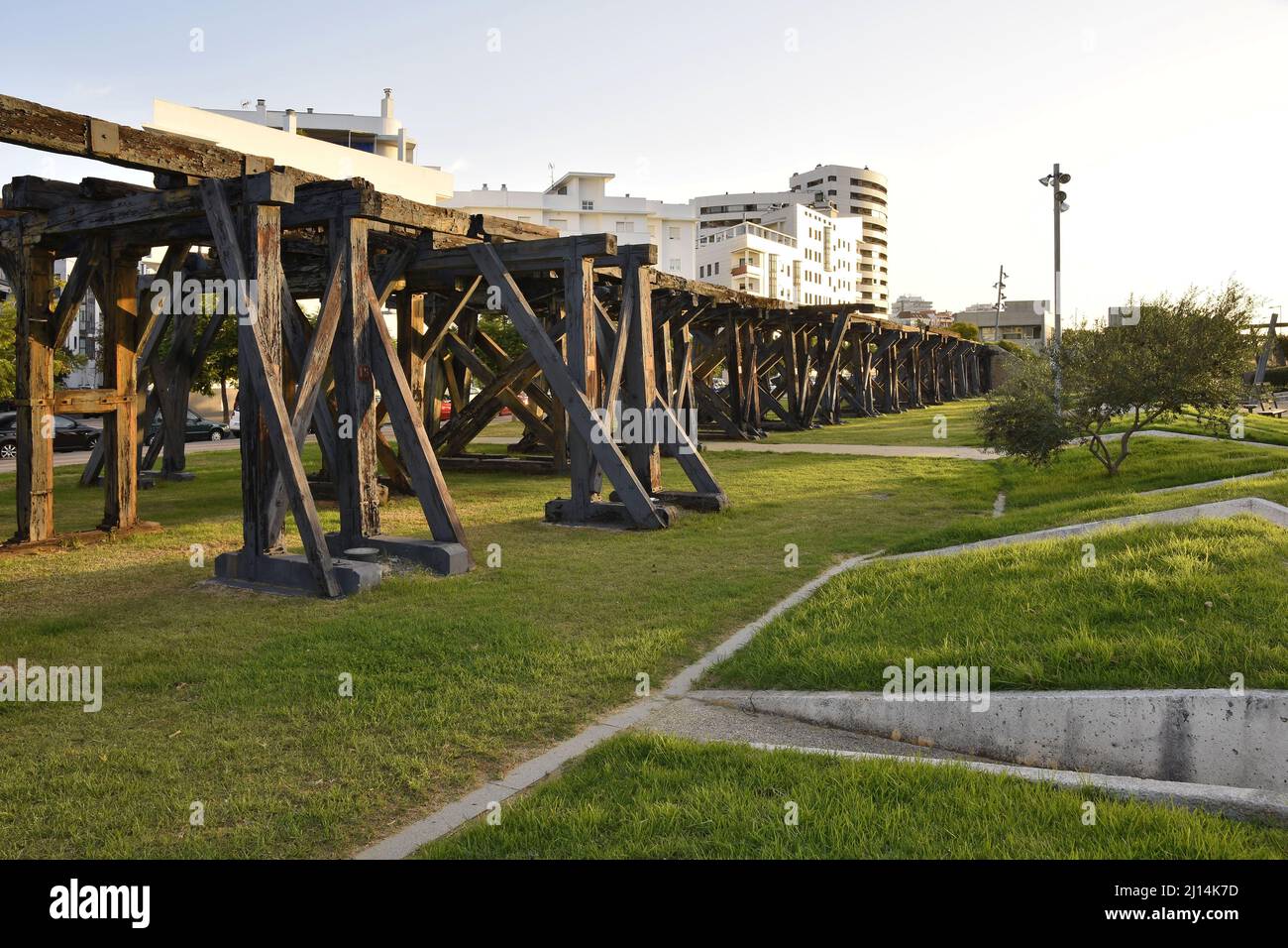 Modern residential blocks and remains of old wooden pier in Huelva ...
