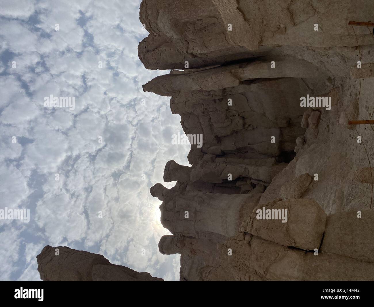A vertical view of the Al-Qarah mountain on a cloudy day in Saudi ...