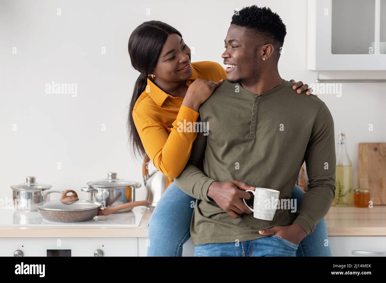Romantic Young African American Couple Hugging And Drinking Coffee In ...