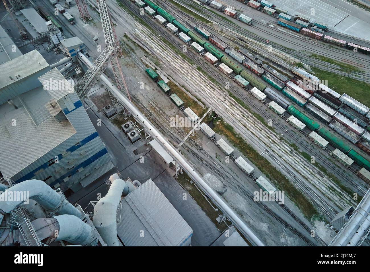 Aerial view of cargo train cars loaded with construction goods at ...