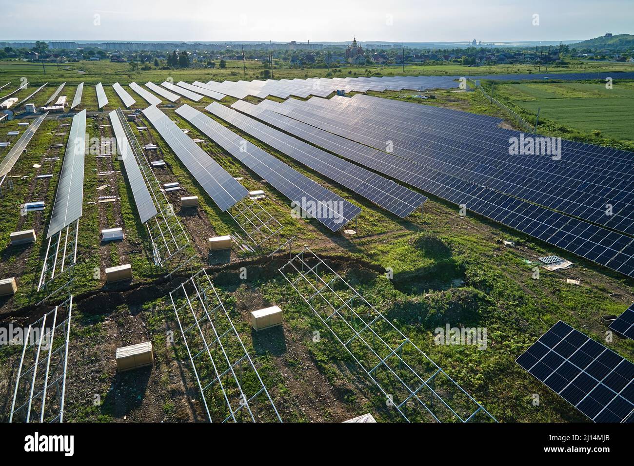 Aerial view of big electric power plant under construction with many ...
