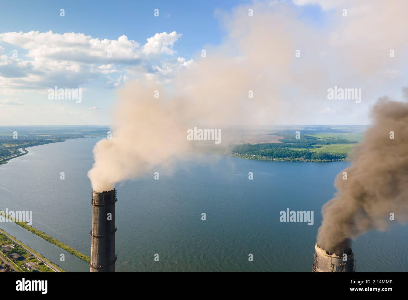 Aerial view of coal power plant high pipes with black smokestack ...