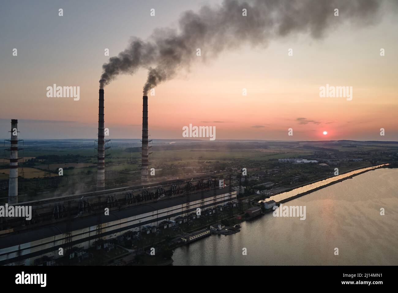 Aerial view of coal power plant high pipes with black smokestack ...