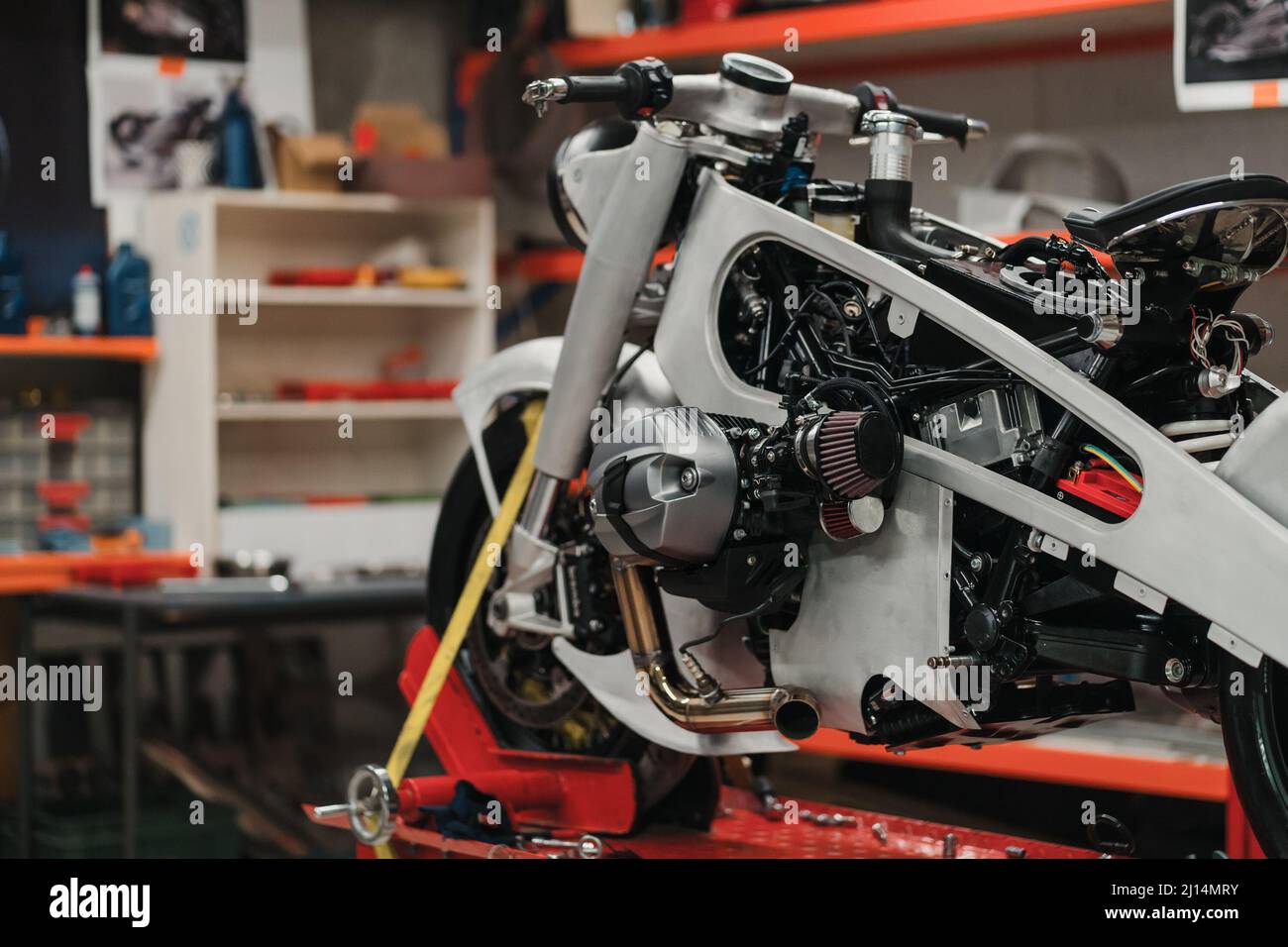 Fixing Custom motorcycle standing in repair shop. Instruments and ...