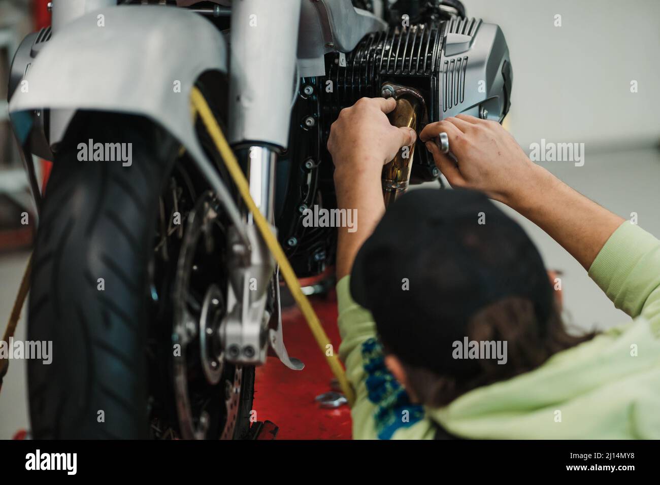 Repairman repair motorcycle, maintenance in garage. Mechanic fixing ...