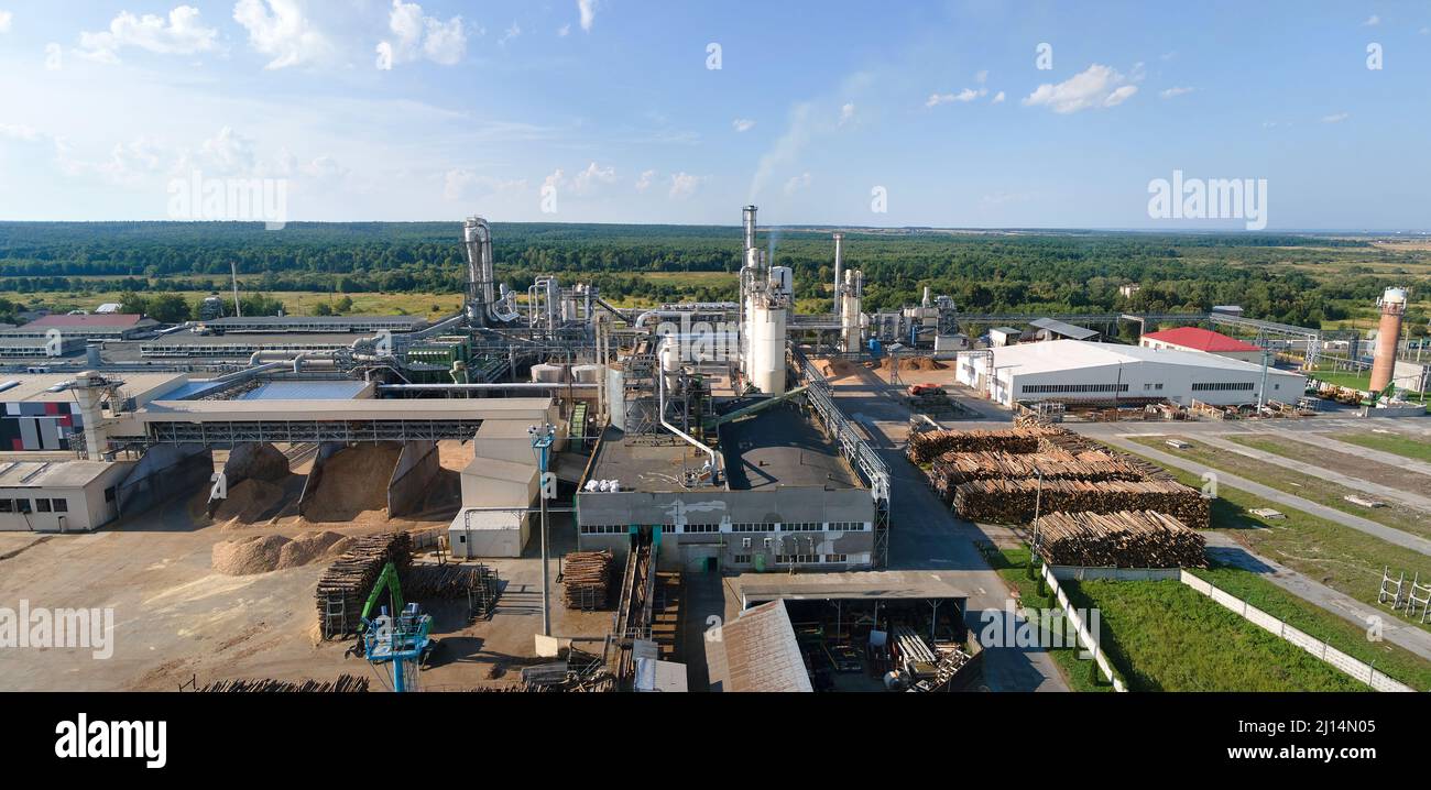Aerial view of wood processing factory with stacks of lumber at plant ...