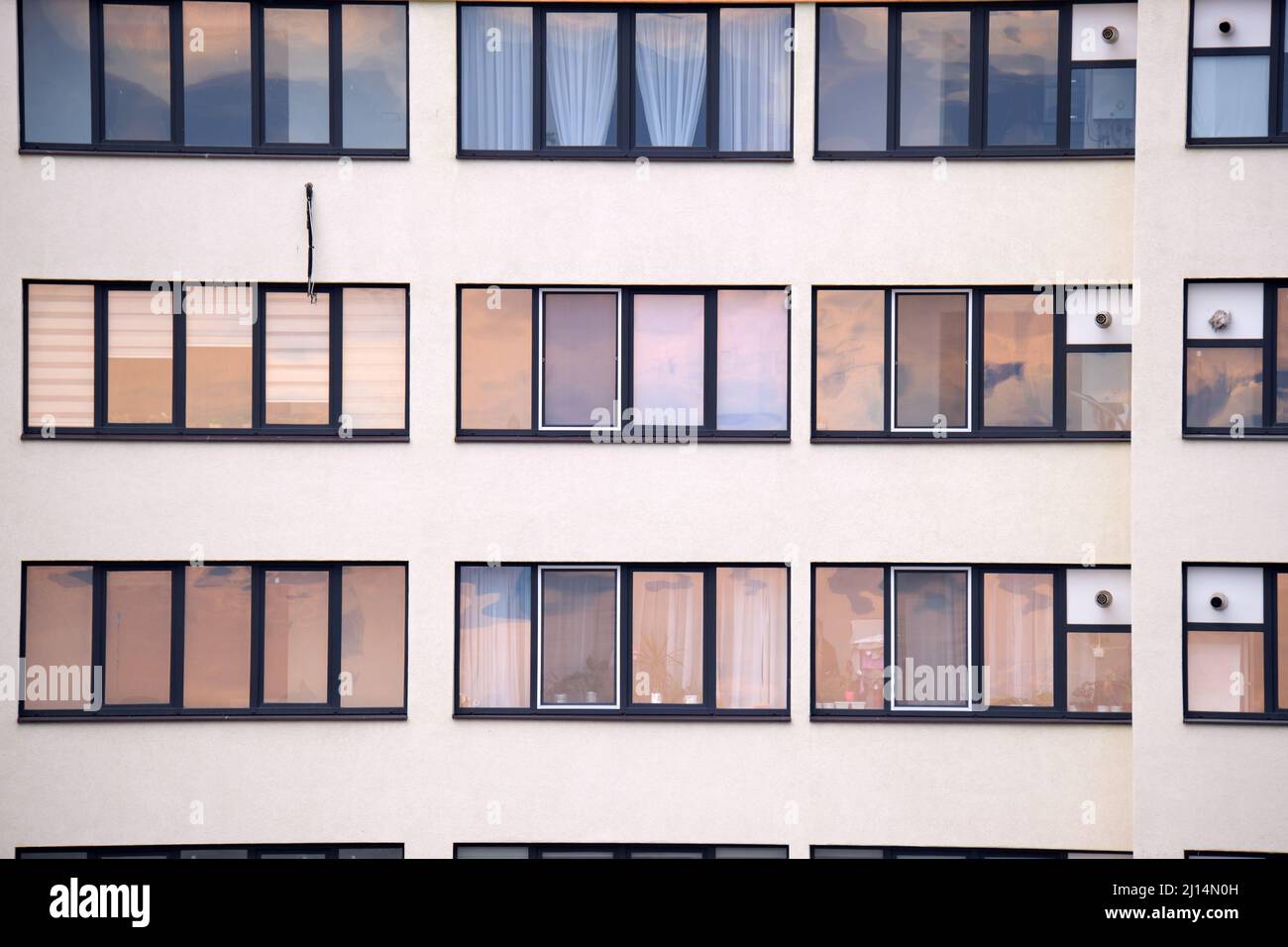 Architectural details of modern high apartment building facade with ...