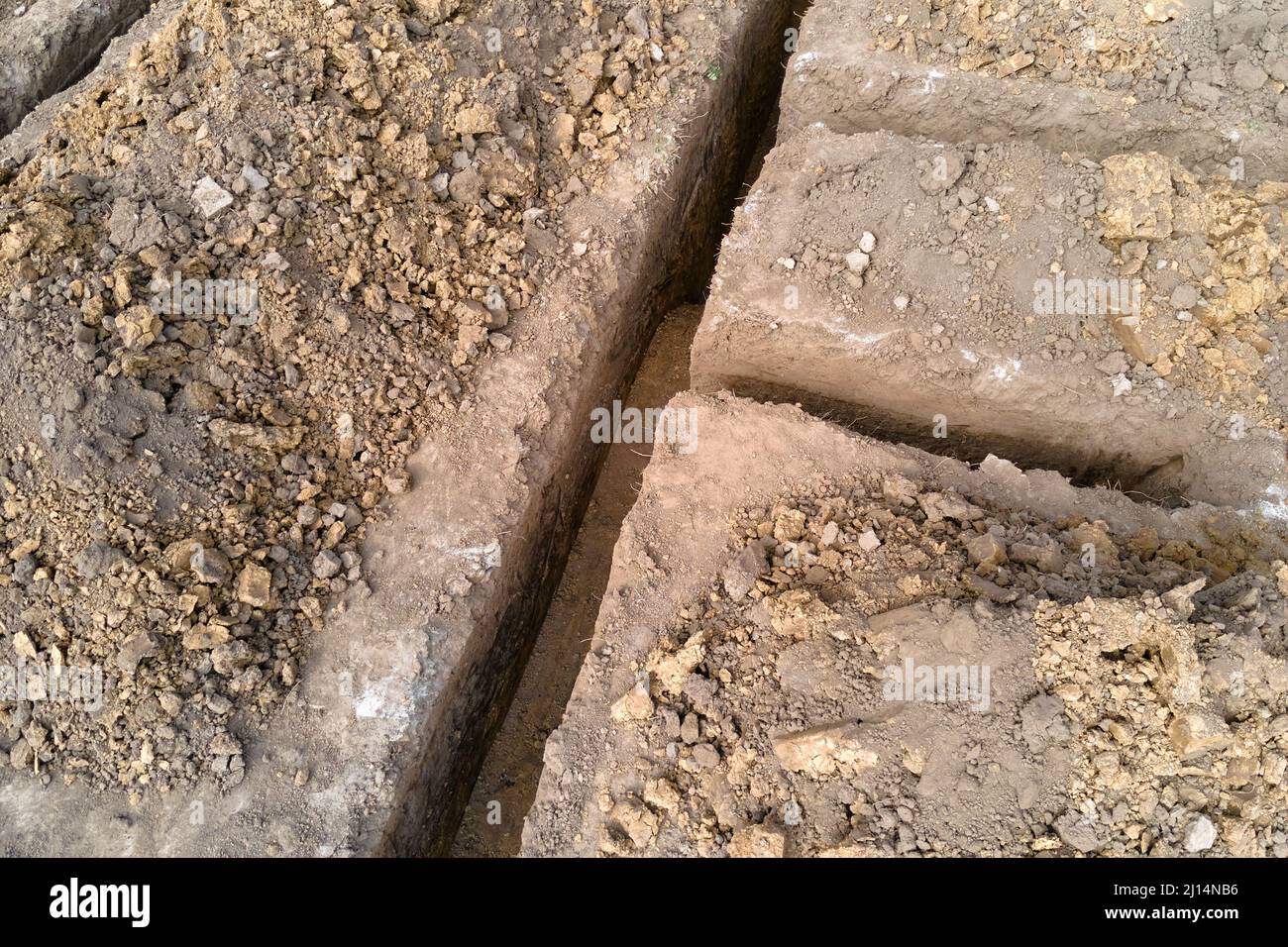 Dug out trench for building works of new house concrete foundation on ...