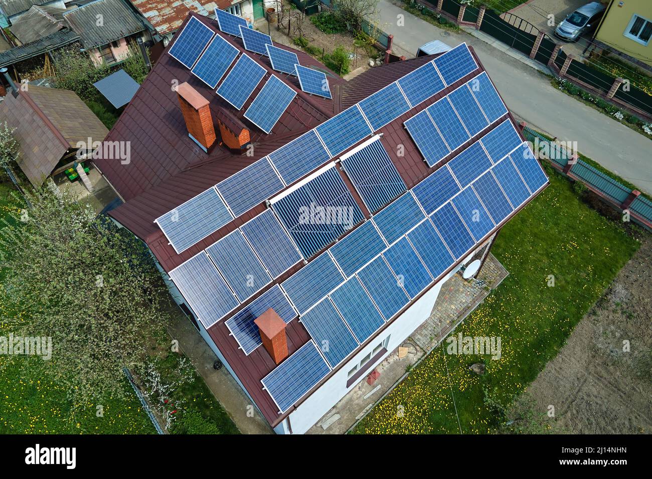 Private home roof covered with solar photovoltaic panels for generating ...