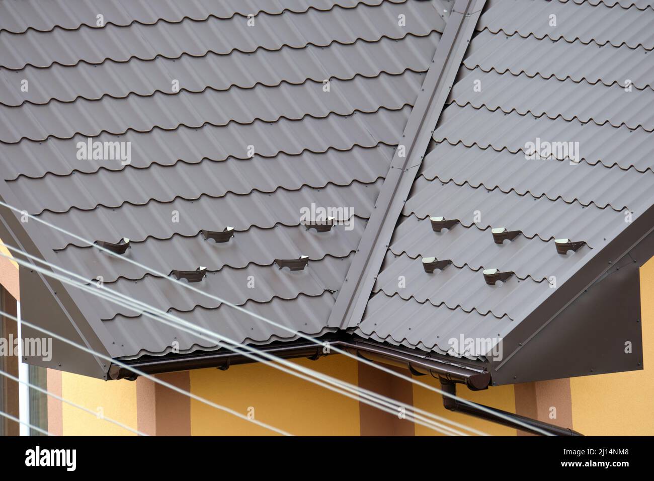 Snow guard for safety in winter on house roof top covered with steel ...