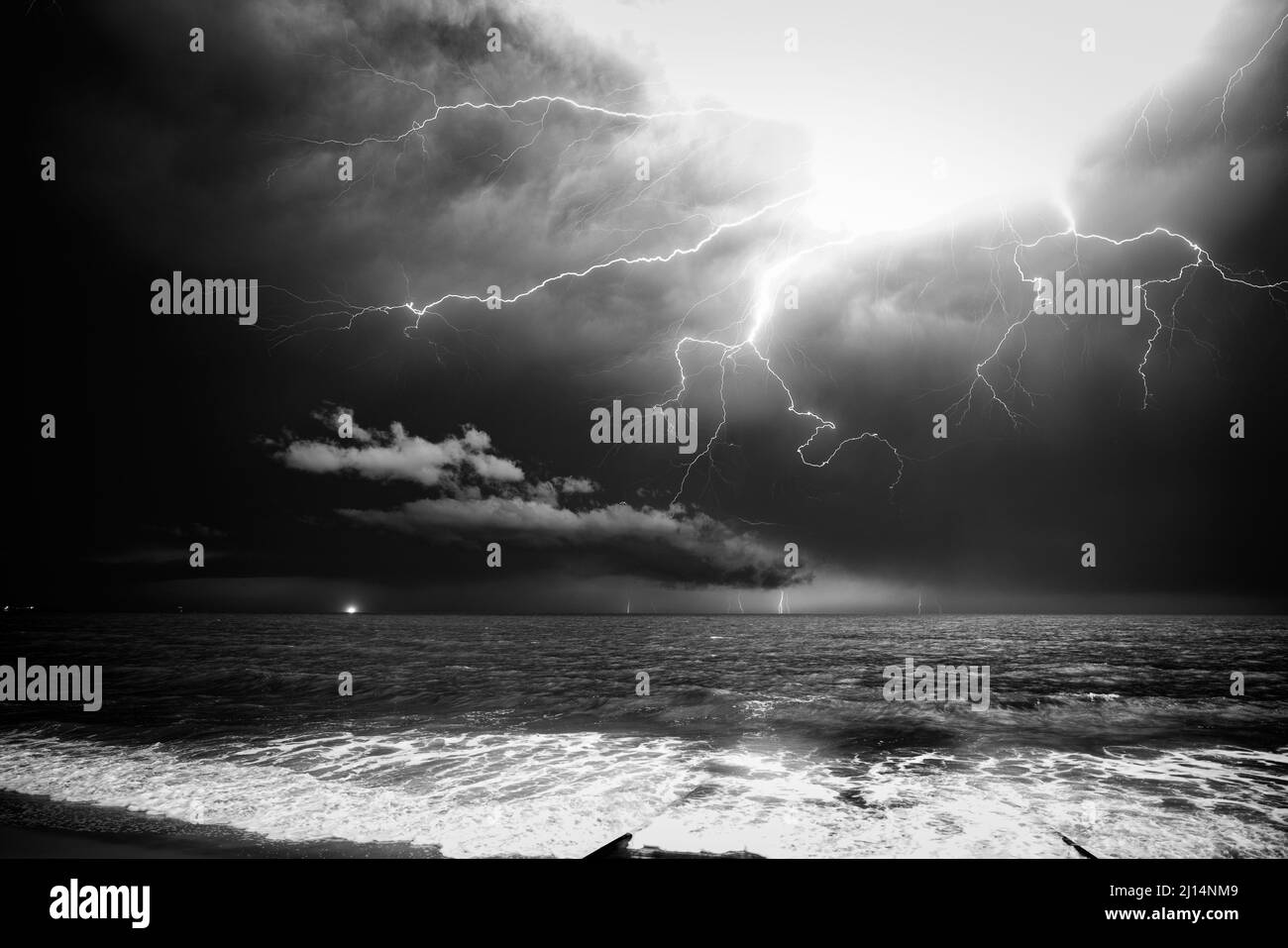 Grayscale shot of dramatic cloudy sky with thunderstorm and lightning ...