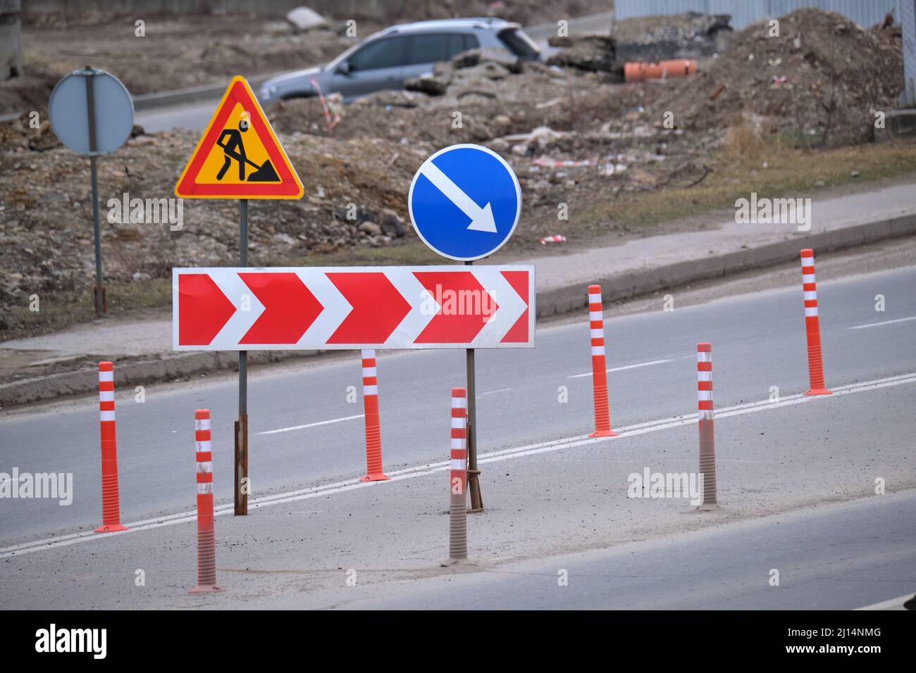 Roadworks warning traffic signs of construction work on city street ...