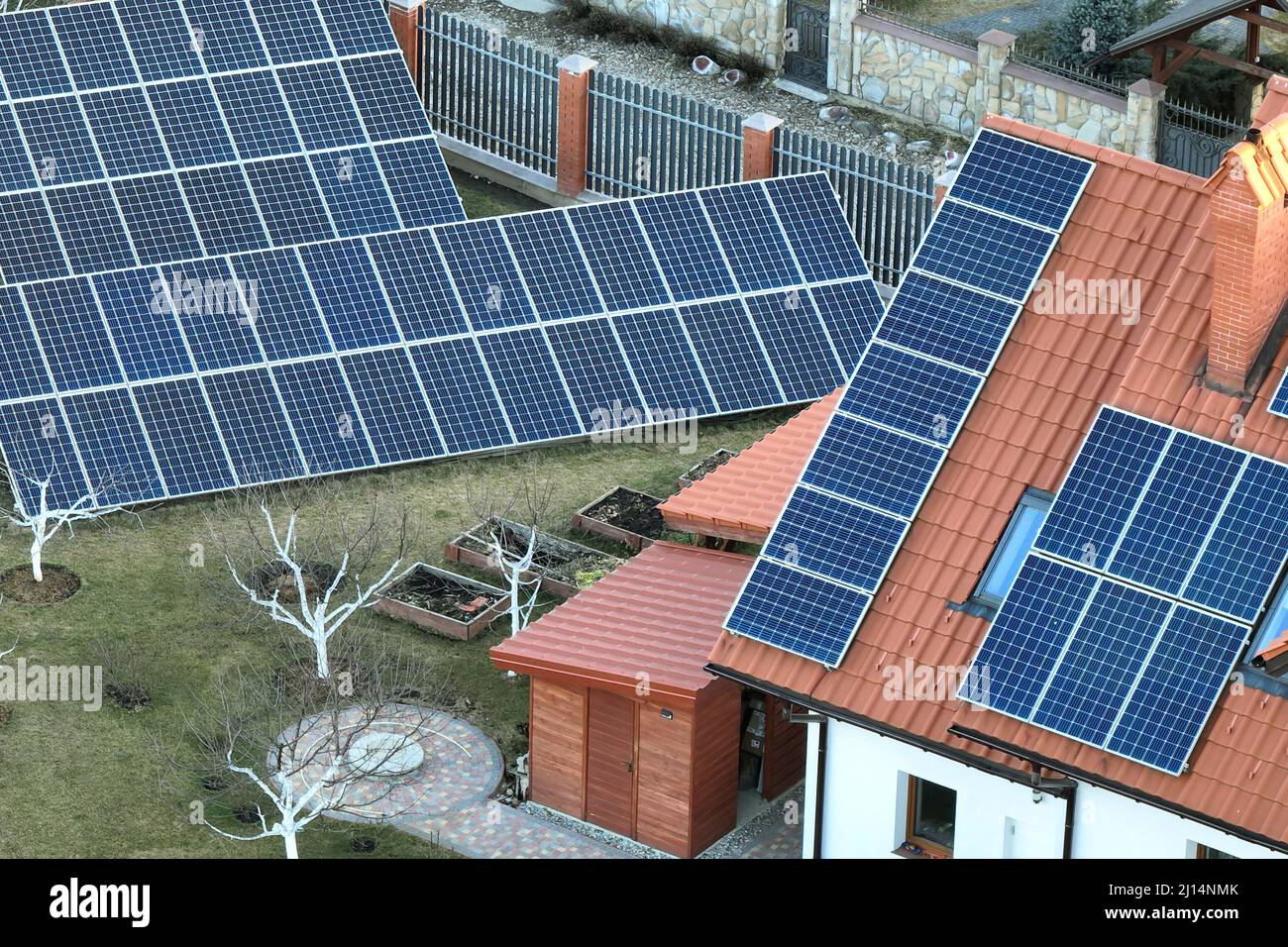 Residential house with rooftop covered with solar photovoltaic panels ...