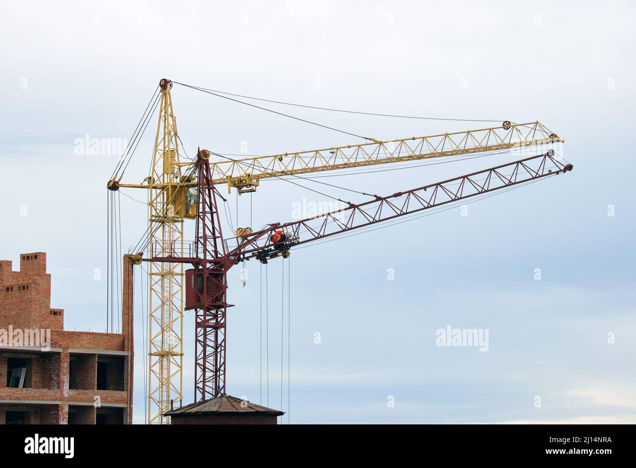 Tower cranes at high residential apartment buildings construction site ...