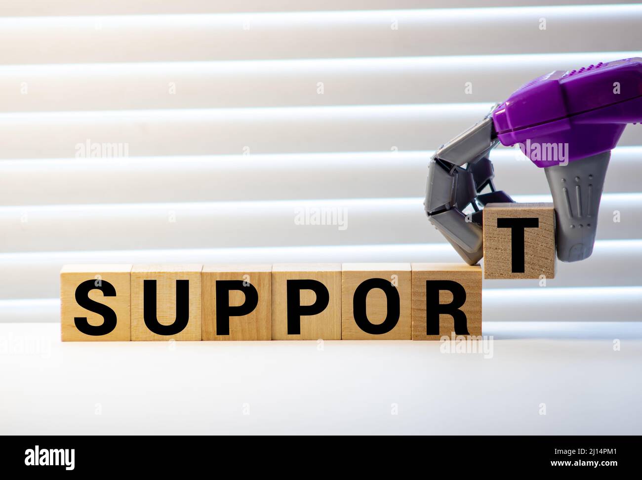Support sign with blocks on a wooden office desk Stock Photo - Alamy