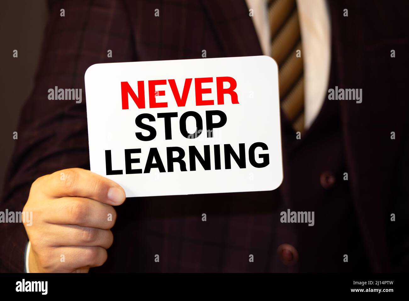 Never Stop Learning card with colorful background with defocused lights ...