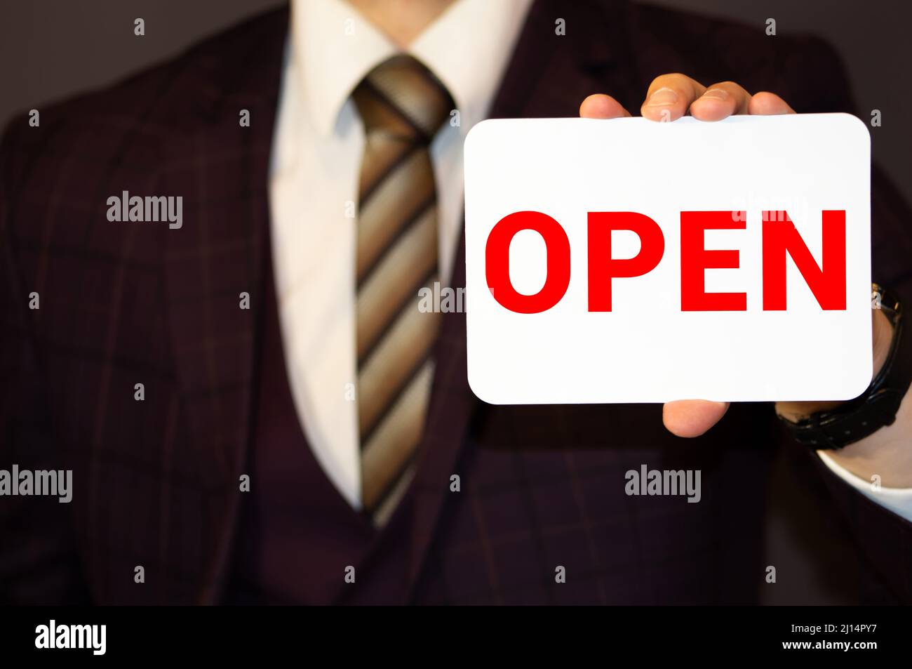 Women hand flip the sign to open the shop. Open sign hanging on the ...