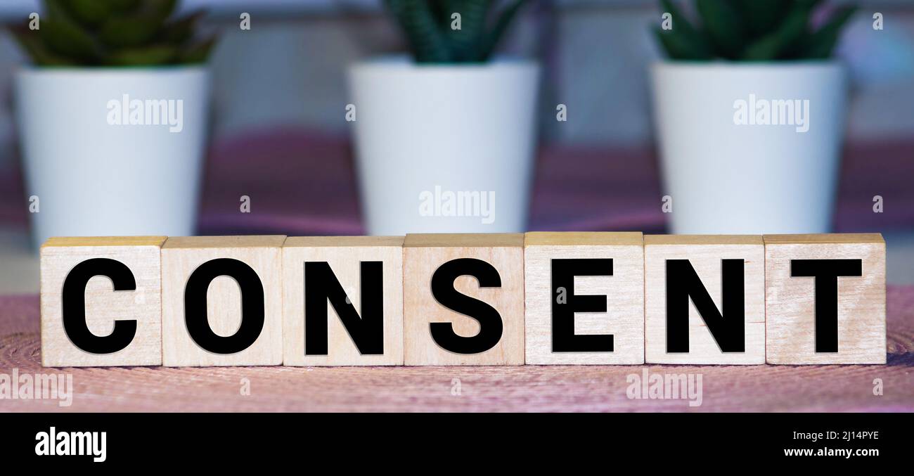 Consent word from wooden blocks on desk Stock Photo - Alamy